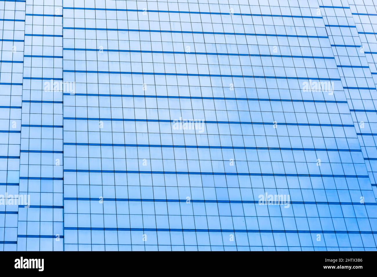 Blue glass windows of office building for background Stock Photo - Alamy