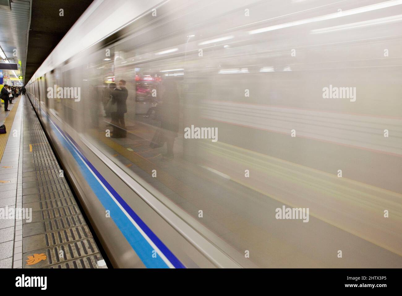 Blur of subway train leaving station Tokyo Japan Stock Photo - Alamy
