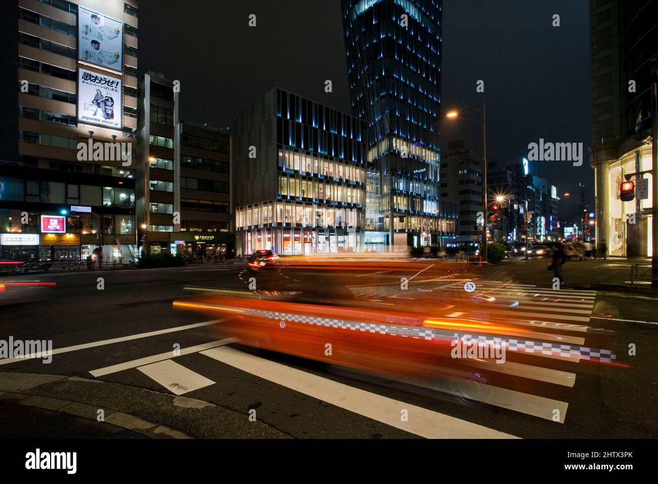 Blur of taxi traffic evening Omotesando Tokyo Japan.tif Stock Photo - Alamy