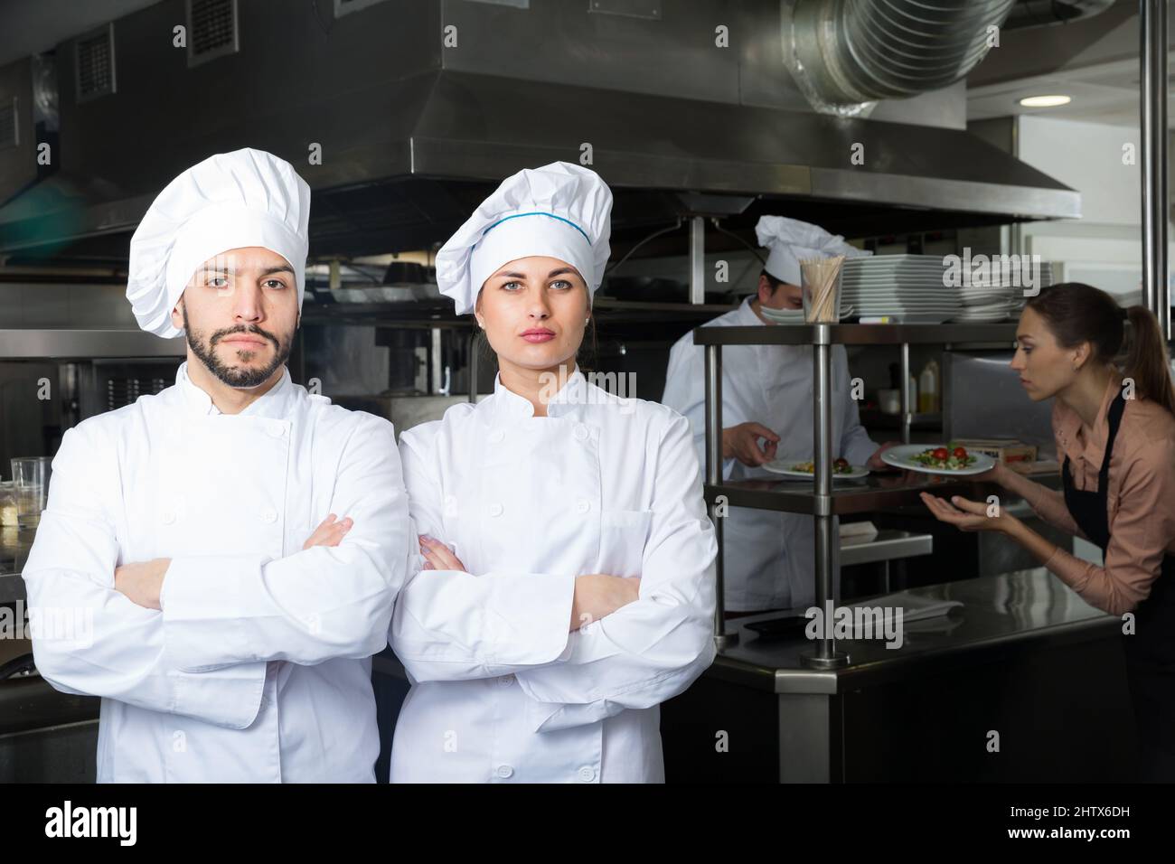 Two chefs in professional kitchen Stock Photo - Alamy