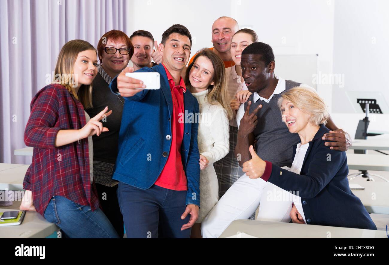 Students doing group selfie Stock Photo - Alamy