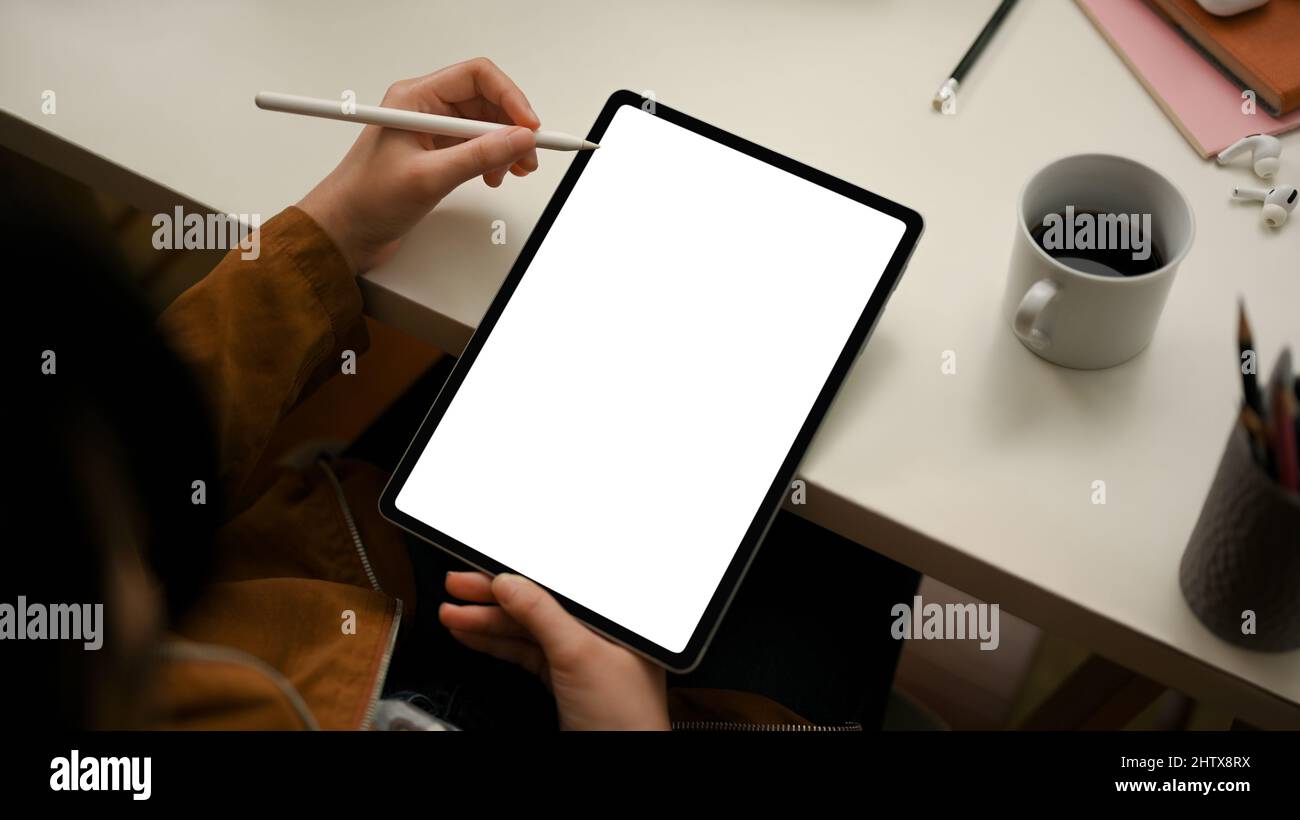 Top view, Female using stylus pen with digital tablet, designing her ...
