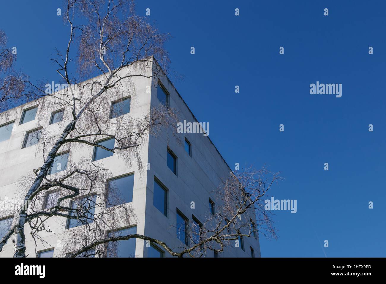 Iconic modern architecture with concrete facade, random pattern and ...