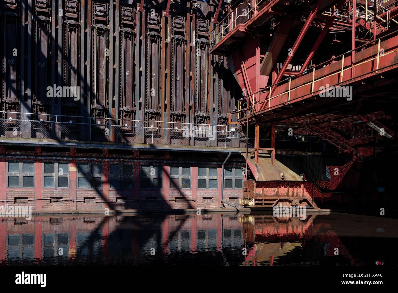Old rusty machine with complex vault, pipeline and utilities in former ...