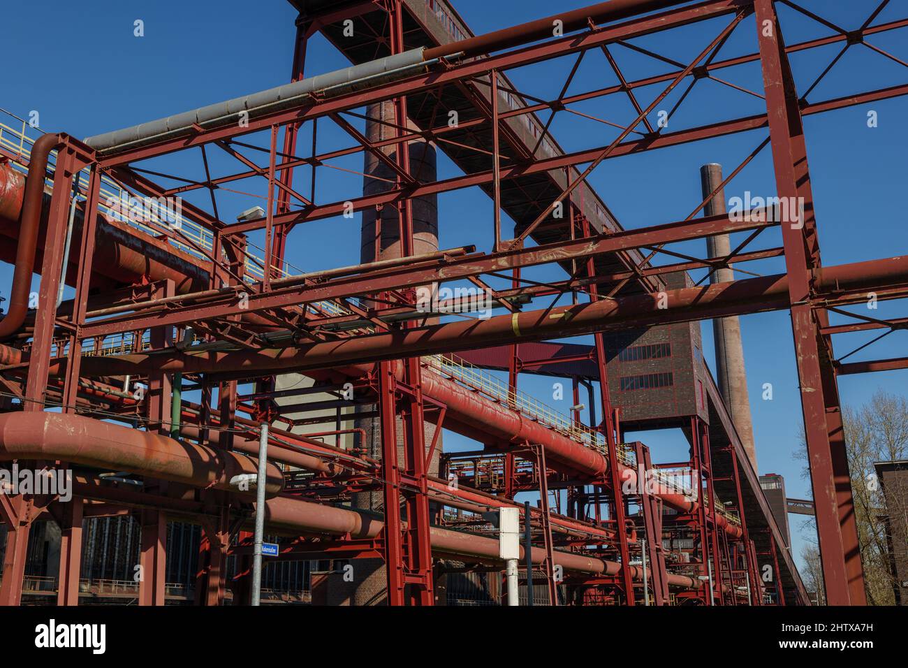 Old rusty machine with complex vault, pipeline and utilities in former ...