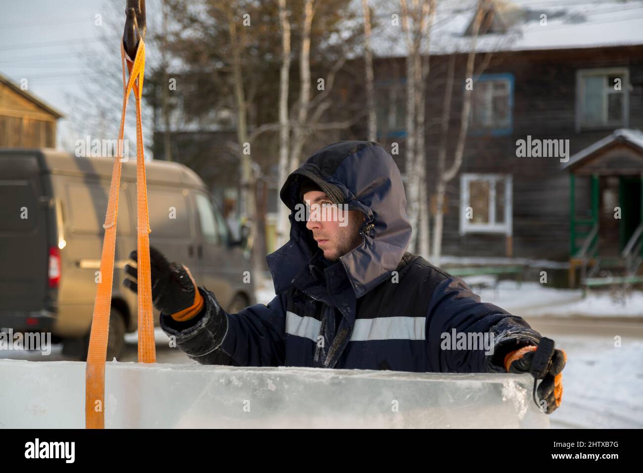 Installer in winter gear at the installation of ice panels Stock Photo ...