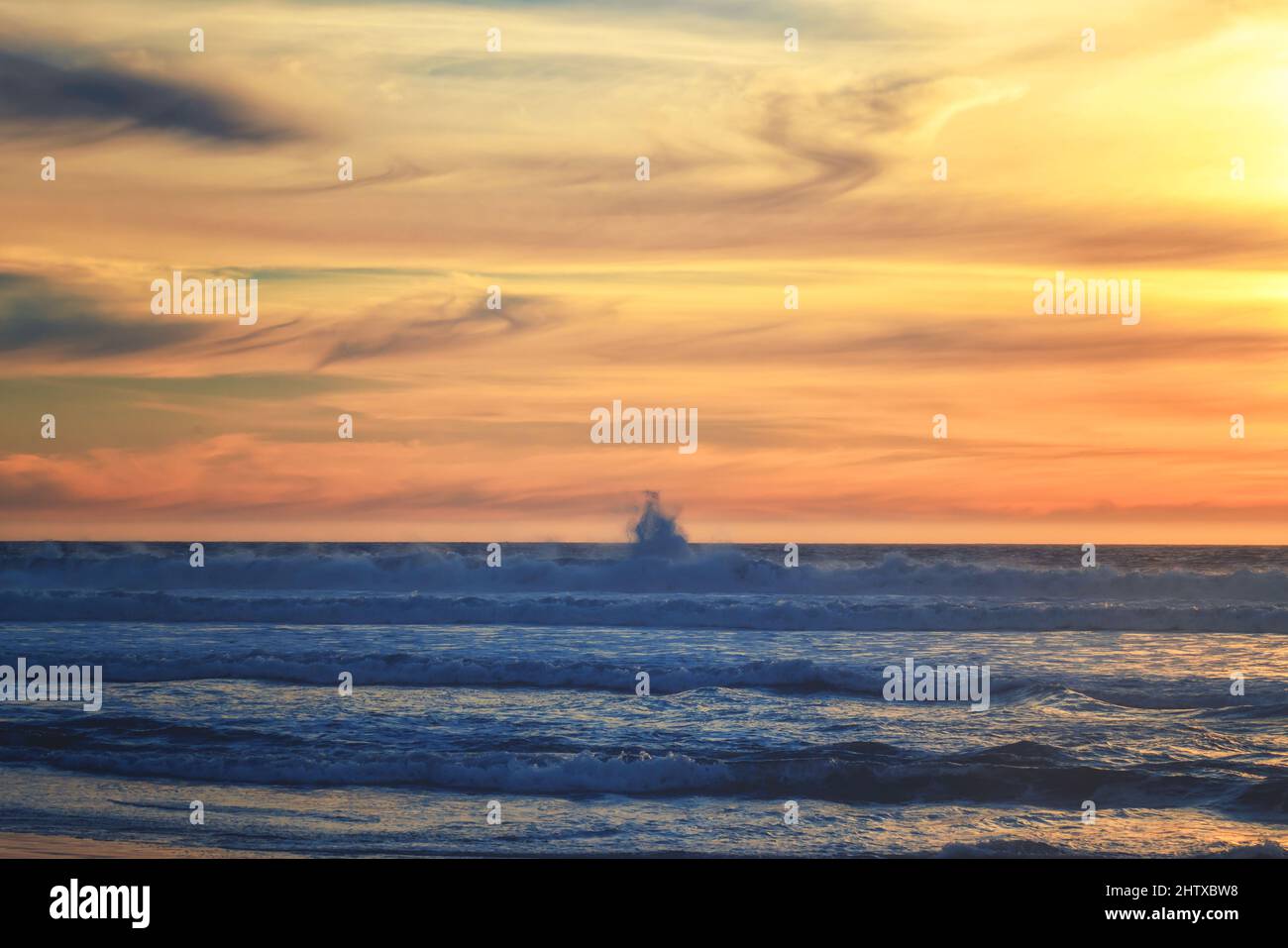 Tropical beach sunset. Empty sand beach, huge waves, and beautiful ...