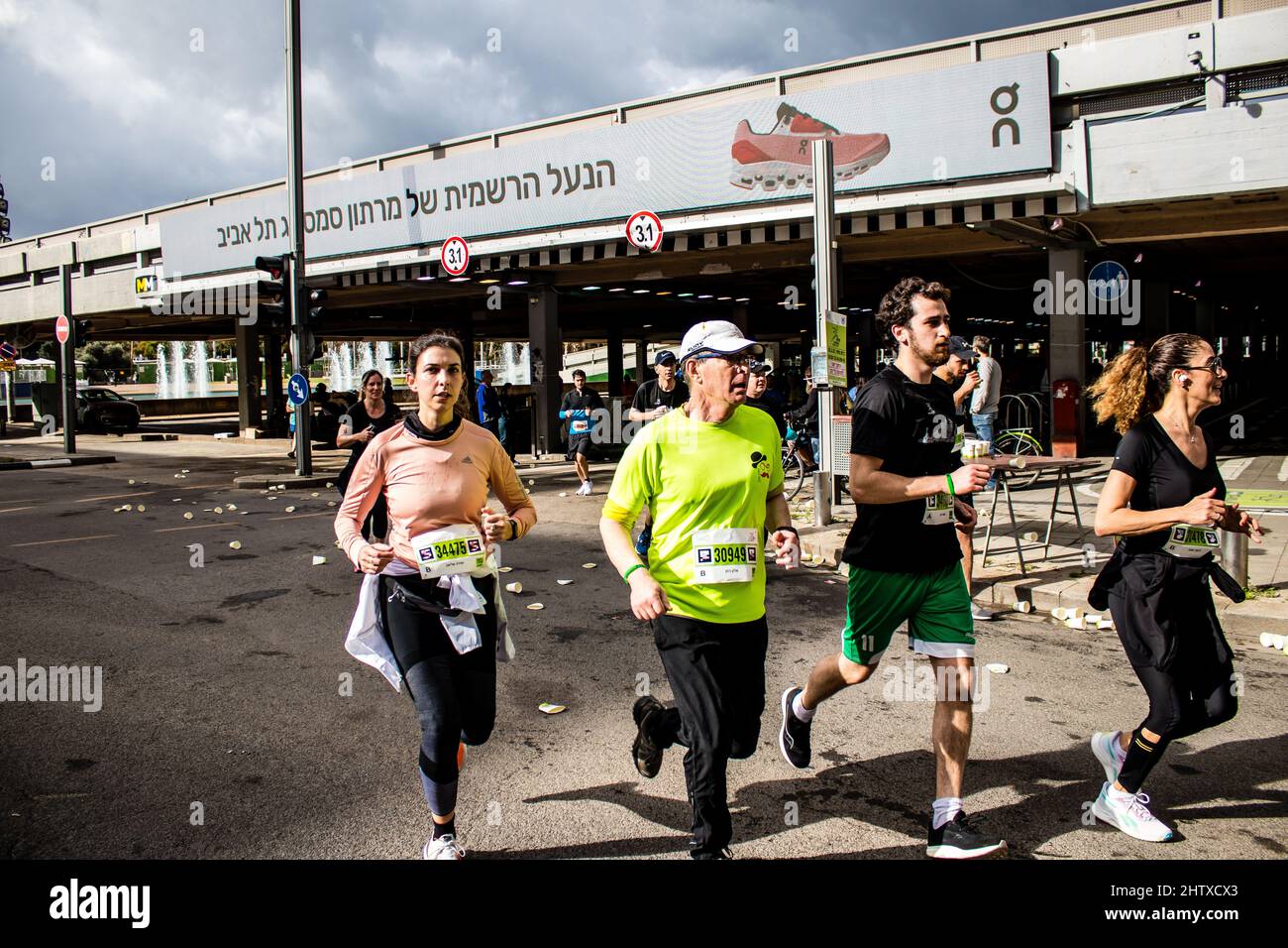 Tel Aviv, Israel - February 25, 2022 Runners in the street of Tel Aviv ...