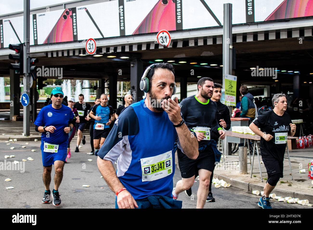 Tel Aviv, Israel - February 25, 2022 Runners in the street of Tel Aviv ...