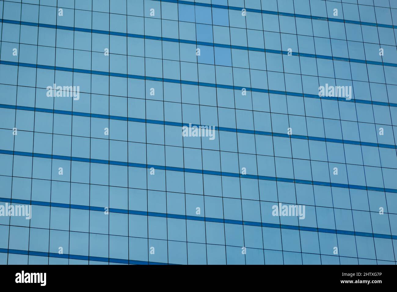 Blue glass windows of office building for background Stock Photo - Alamy