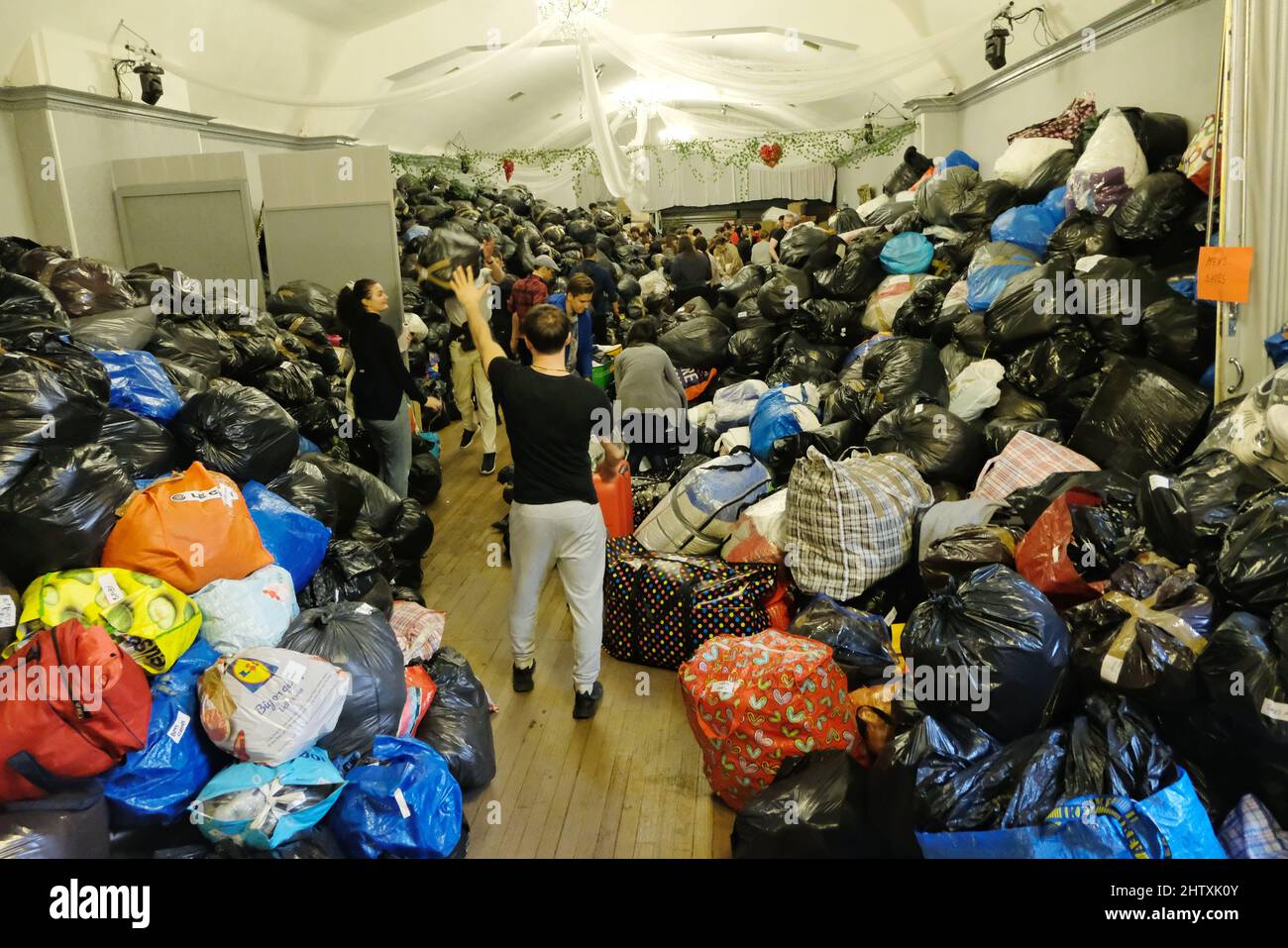 London, UK, 2nd Mar, 2022. Volunteers sort through donations of ...