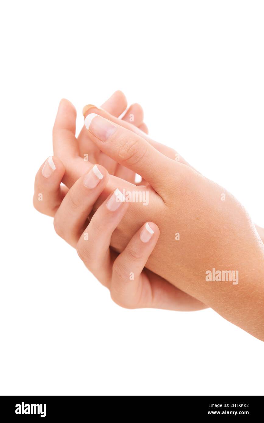 Enjoying her silky smooth skin after a french manicure. Cropped shot of ...