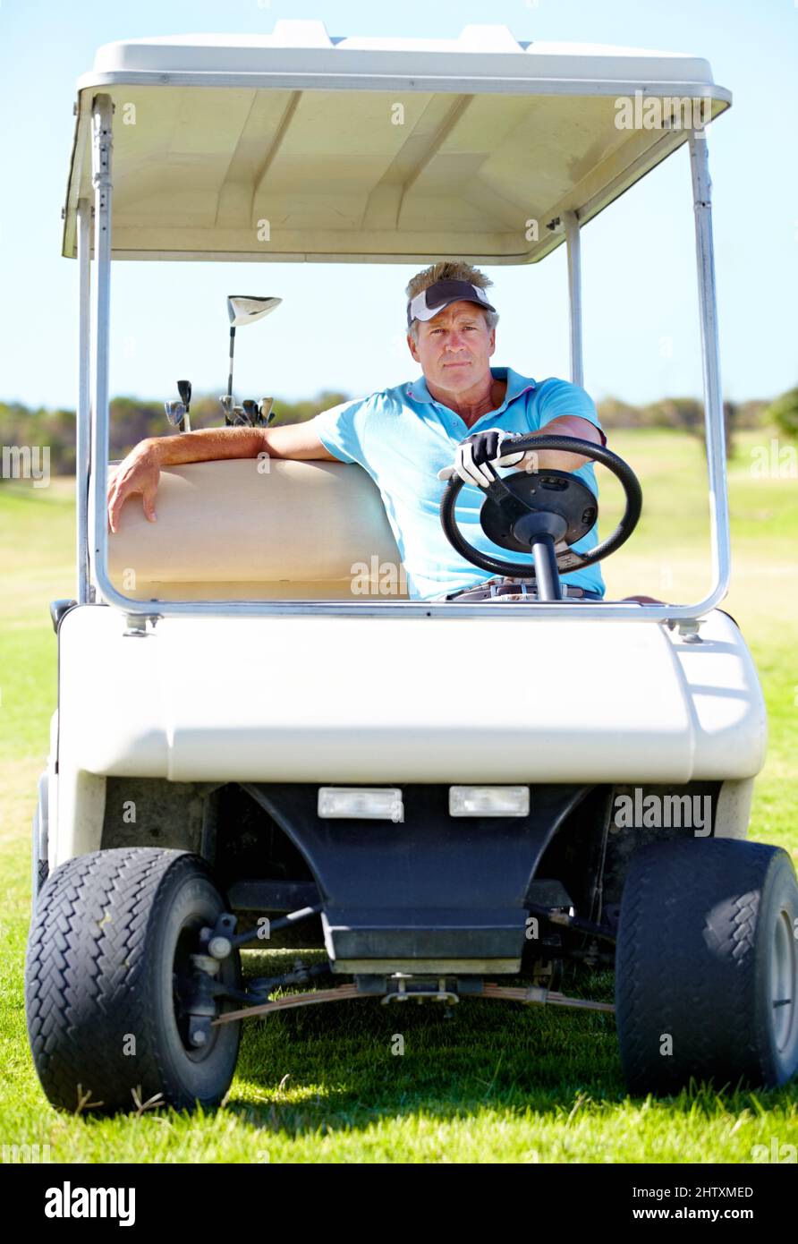 Golf cart driving across green hi-res stock photography and images - Alamy
