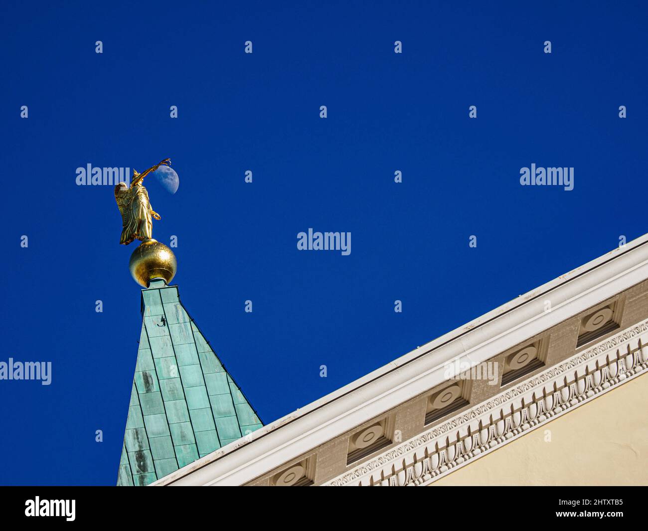 Protestant town church, tower with peace angel and crescent moon ...