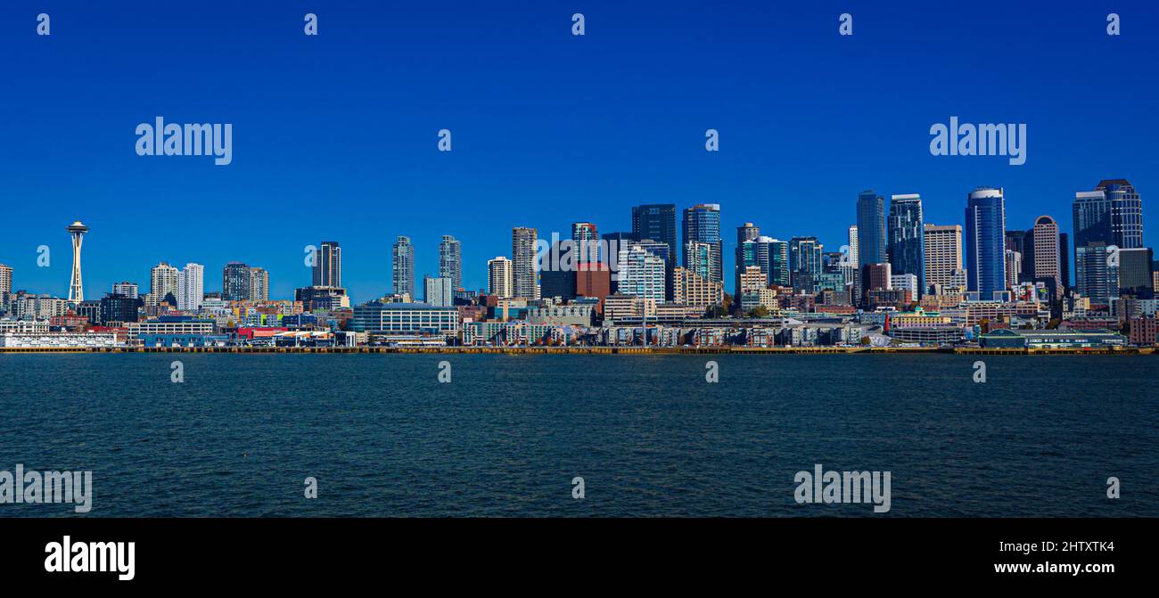 Panoramic shot of Seattle skyline with clear blue sky and the Lake ...