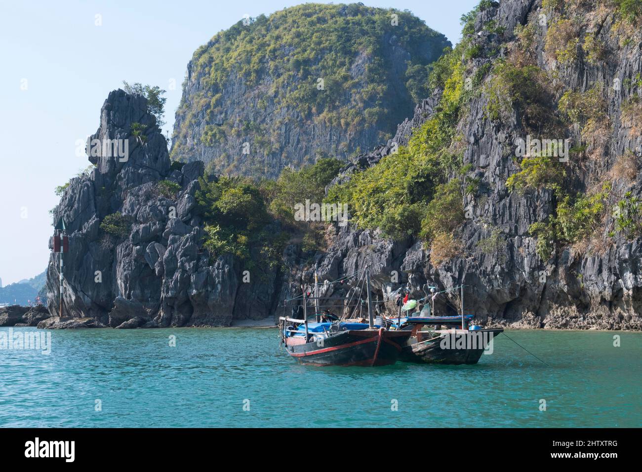 Fishing boats in Halong Bay, Gulf of Tonkin, Vietnam Stock Photo - Alamy