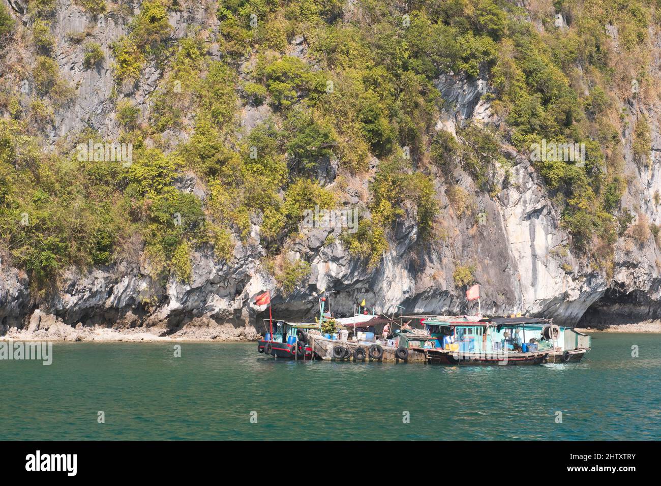 Fishing boats in Halong Bay, Gulf of Tonkin, Vietnam Stock Photo - Alamy