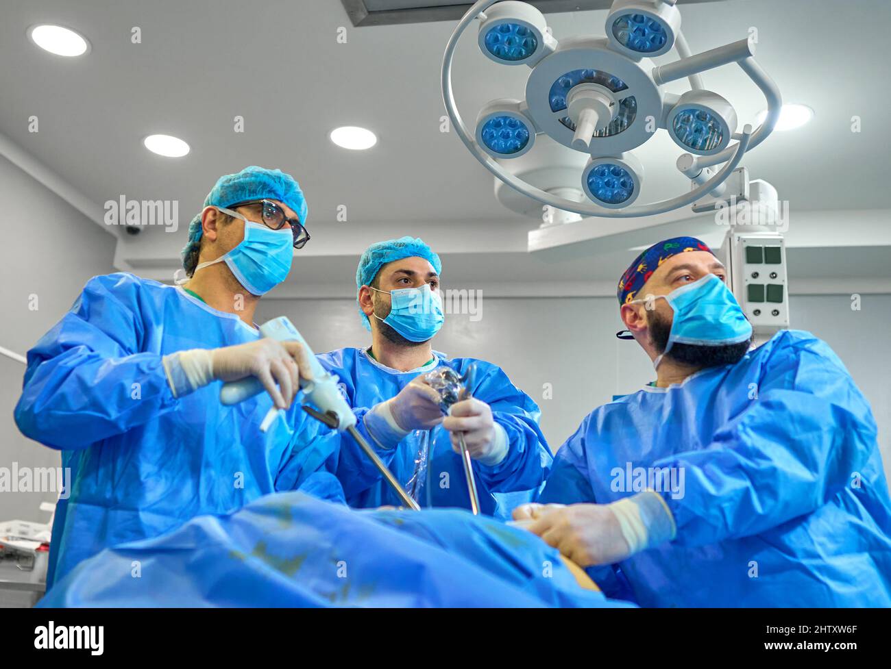 Group doctors perform operation patient hi-res stock photography and ...