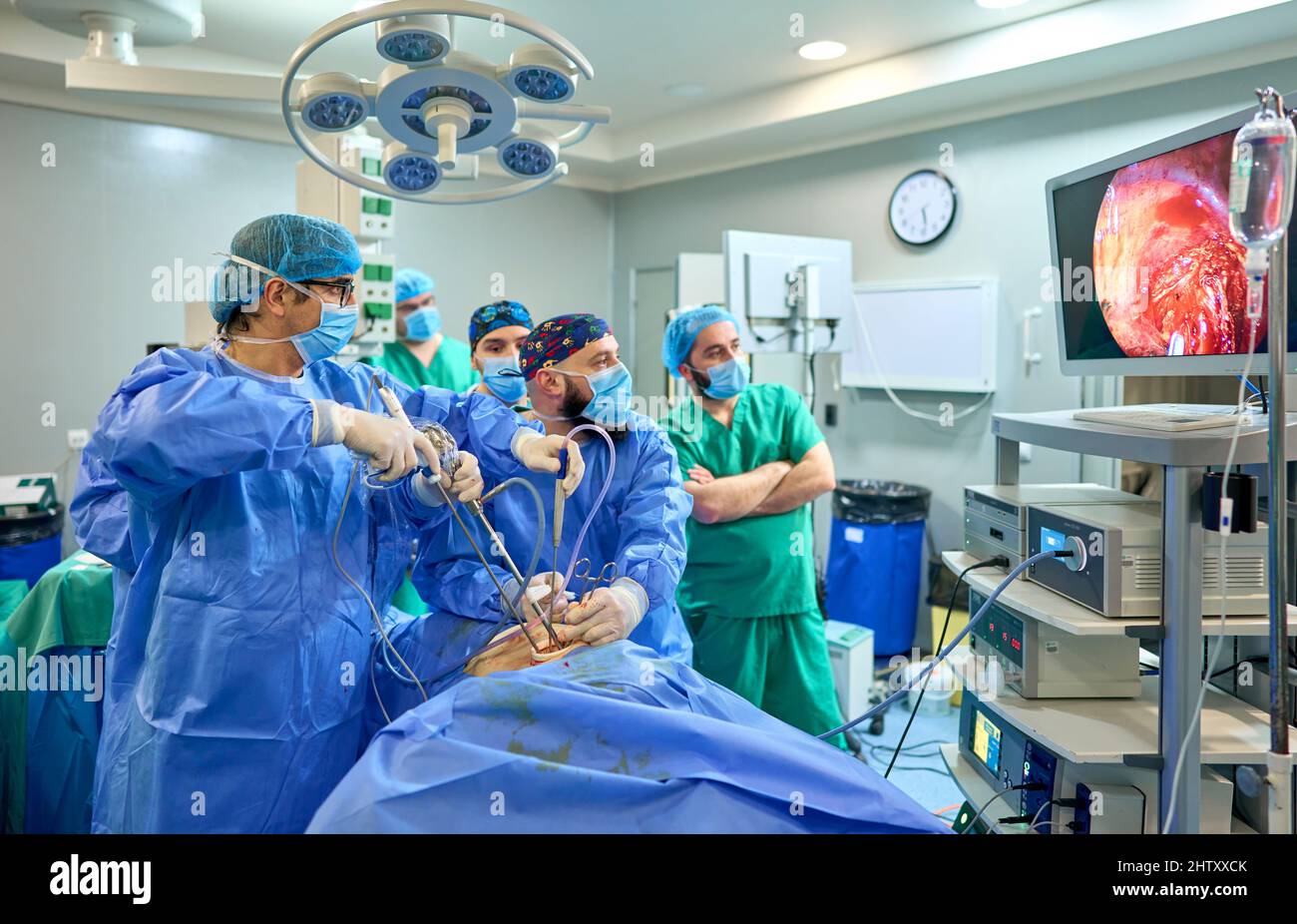 doctors in the operating room perform surgery on a patient Stock Photo ...