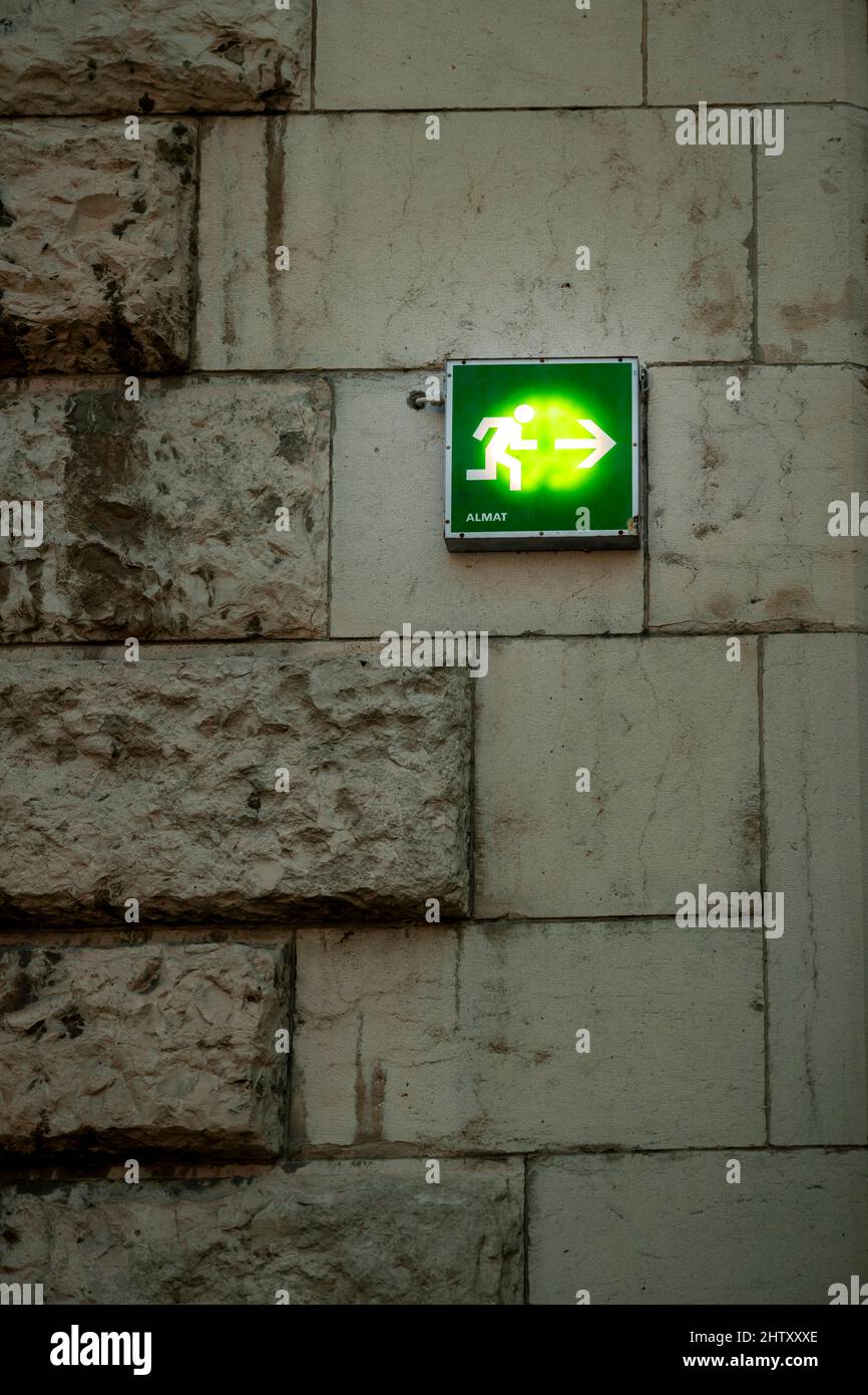 Rescue sign, emergency exit, sign on a wall Stock Photo - Alamy