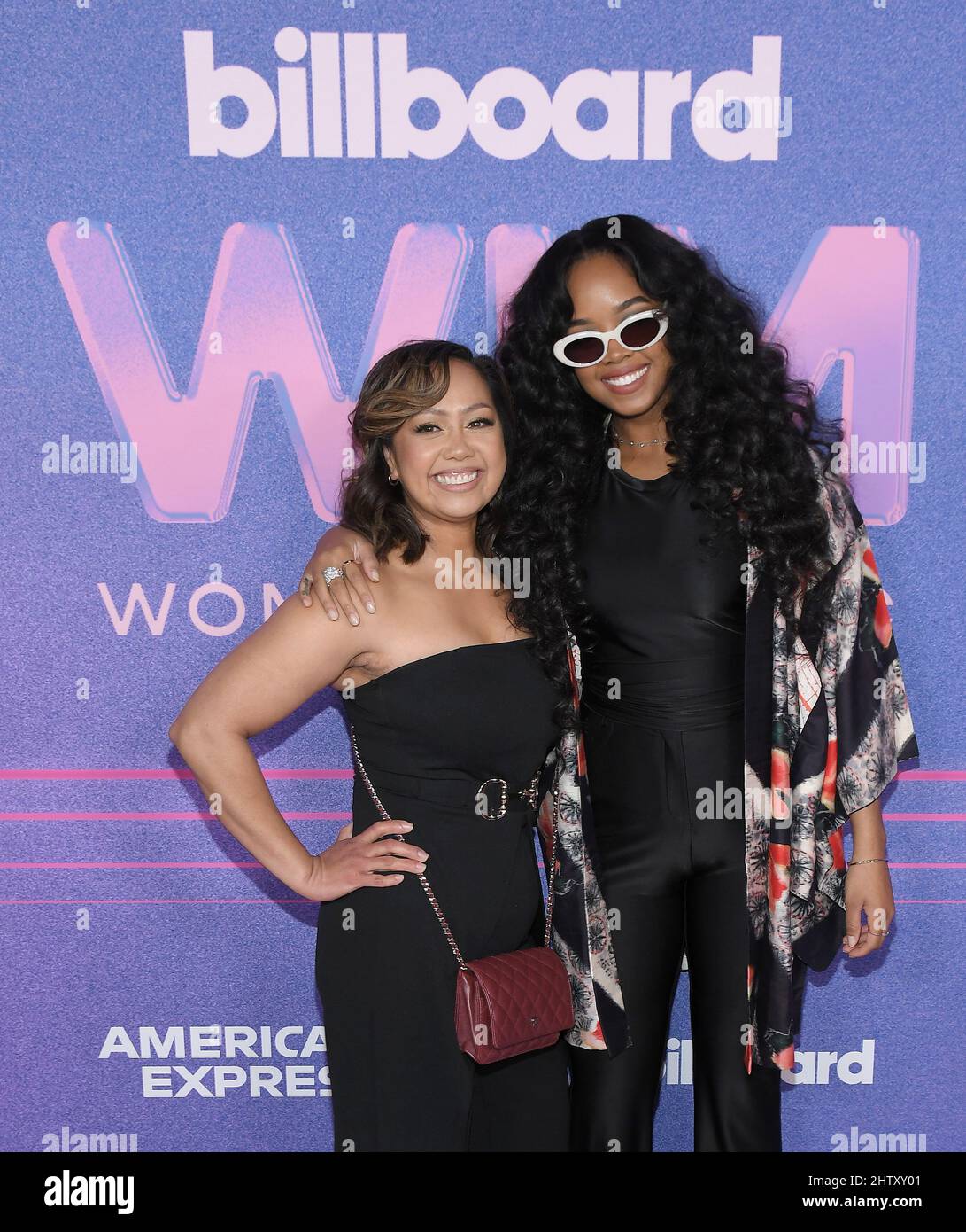 (L-R) Agnes Wilson and H.E.R. at the 2022 Billboard Women in Music held ...