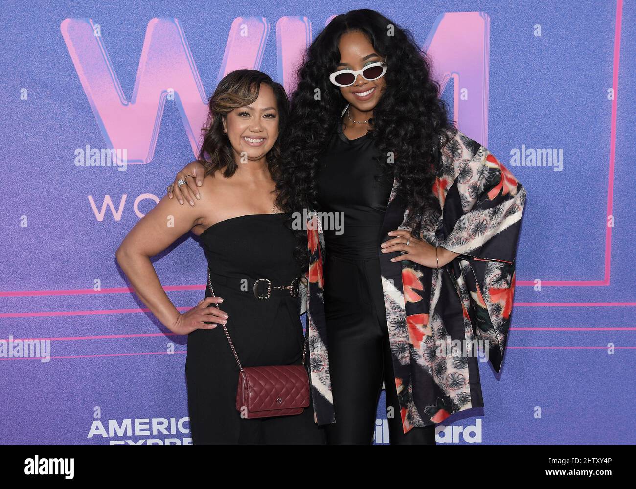(L-R) Agnes Wilson and H.E.R. at the 2022 Billboard Women in Music held ...