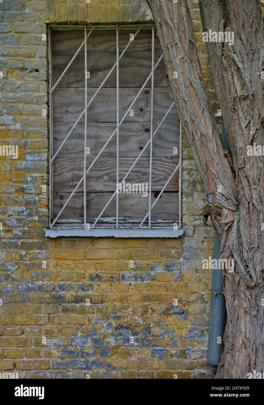Lost Place, window secured with plywood in a former barracks of the ...