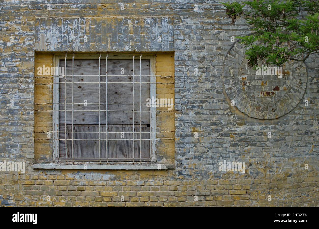Lost Place, Window secured with plywood in a former barracks of the ...