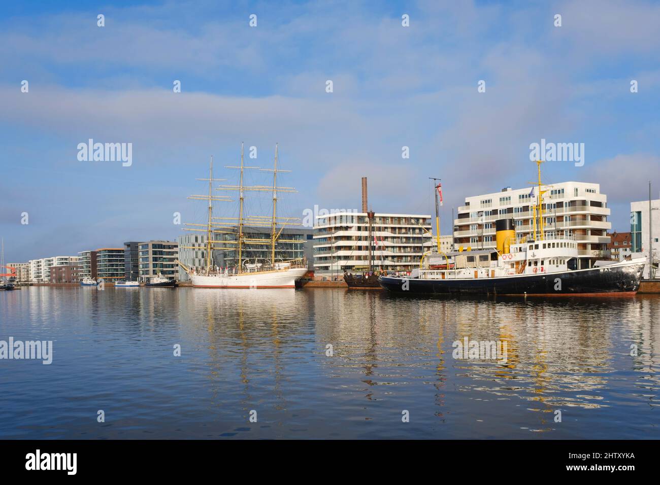 Modern buildings and traditional ships in the new harbour, Havenwelten ...