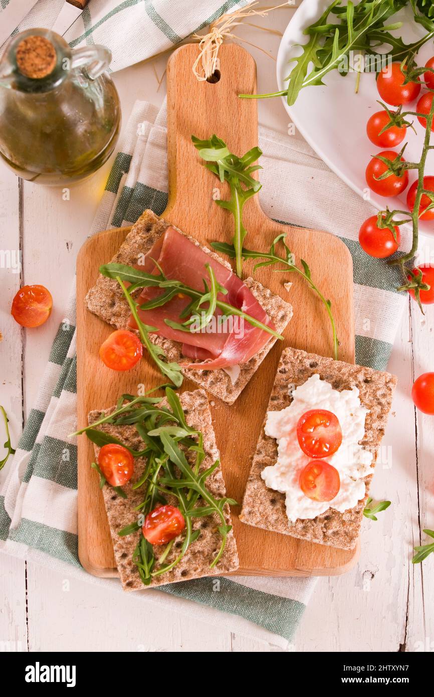 Crispy rye bread with sesame seeds, ham and cottage cheese Stock Photo ...