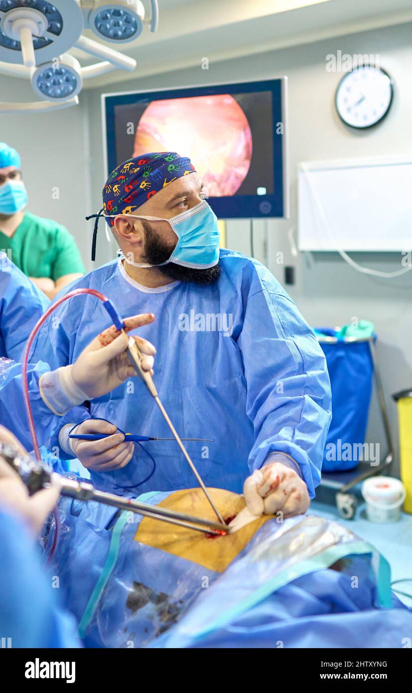 doctors in the operating room perform surgery on a patient Stock Photo ...