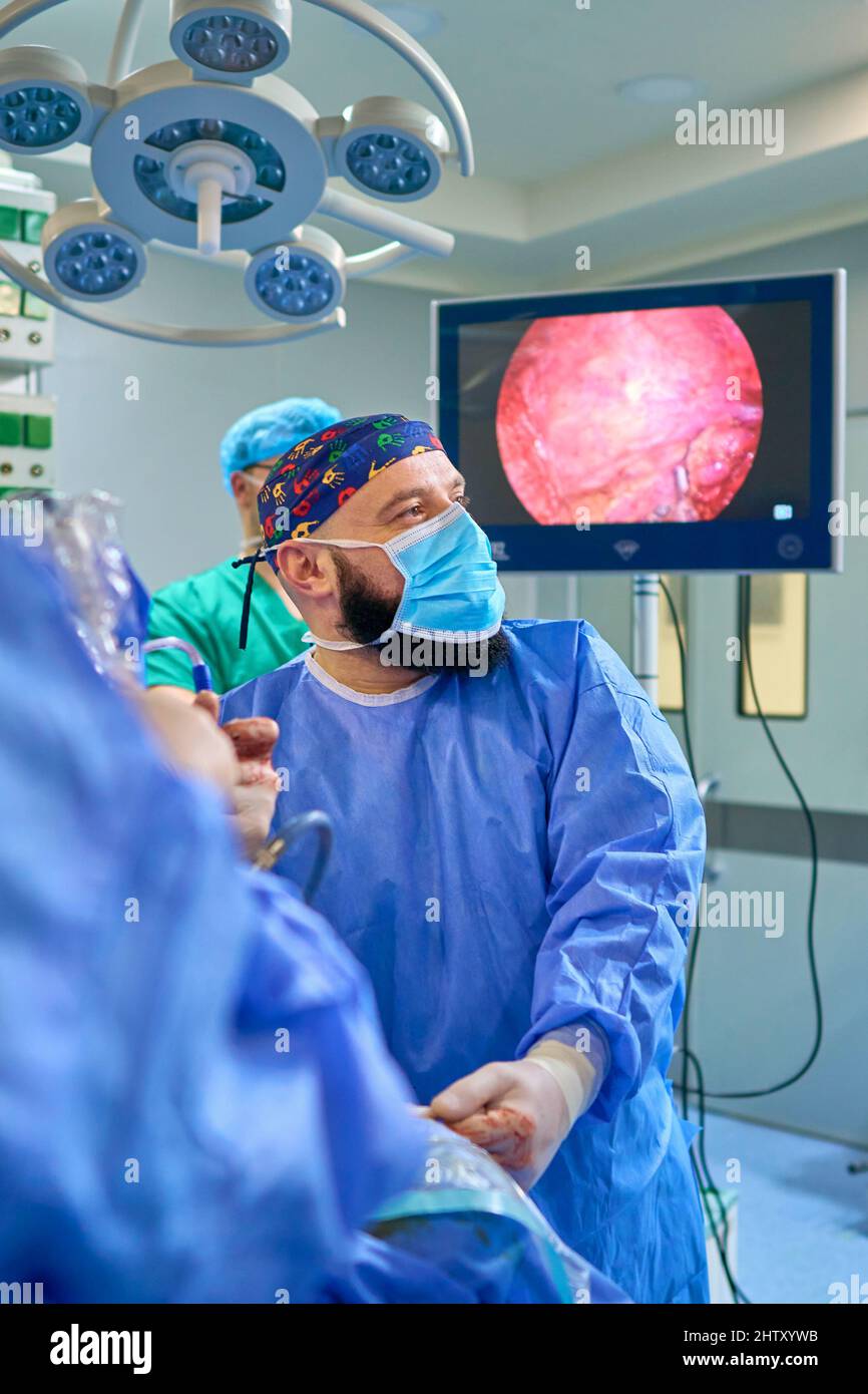 doctors in the operating room perform surgery on a patient Stock Photo ...