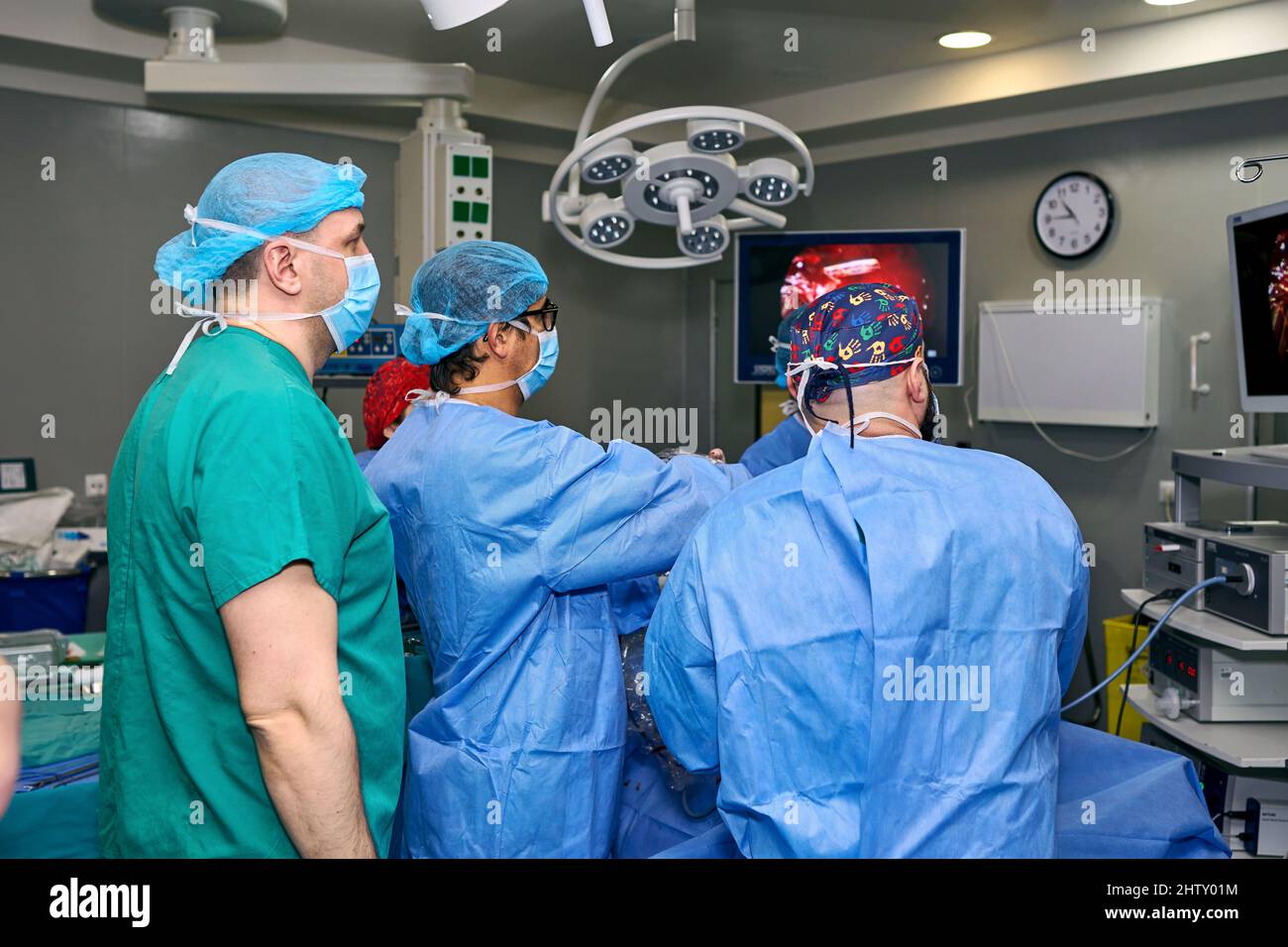 doctors in the operating room perform surgery on a patient Stock Photo ...