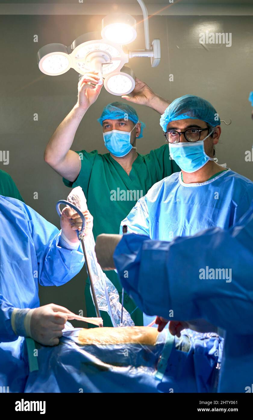 doctors in the operating room perform surgery on a patient Stock Photo ...