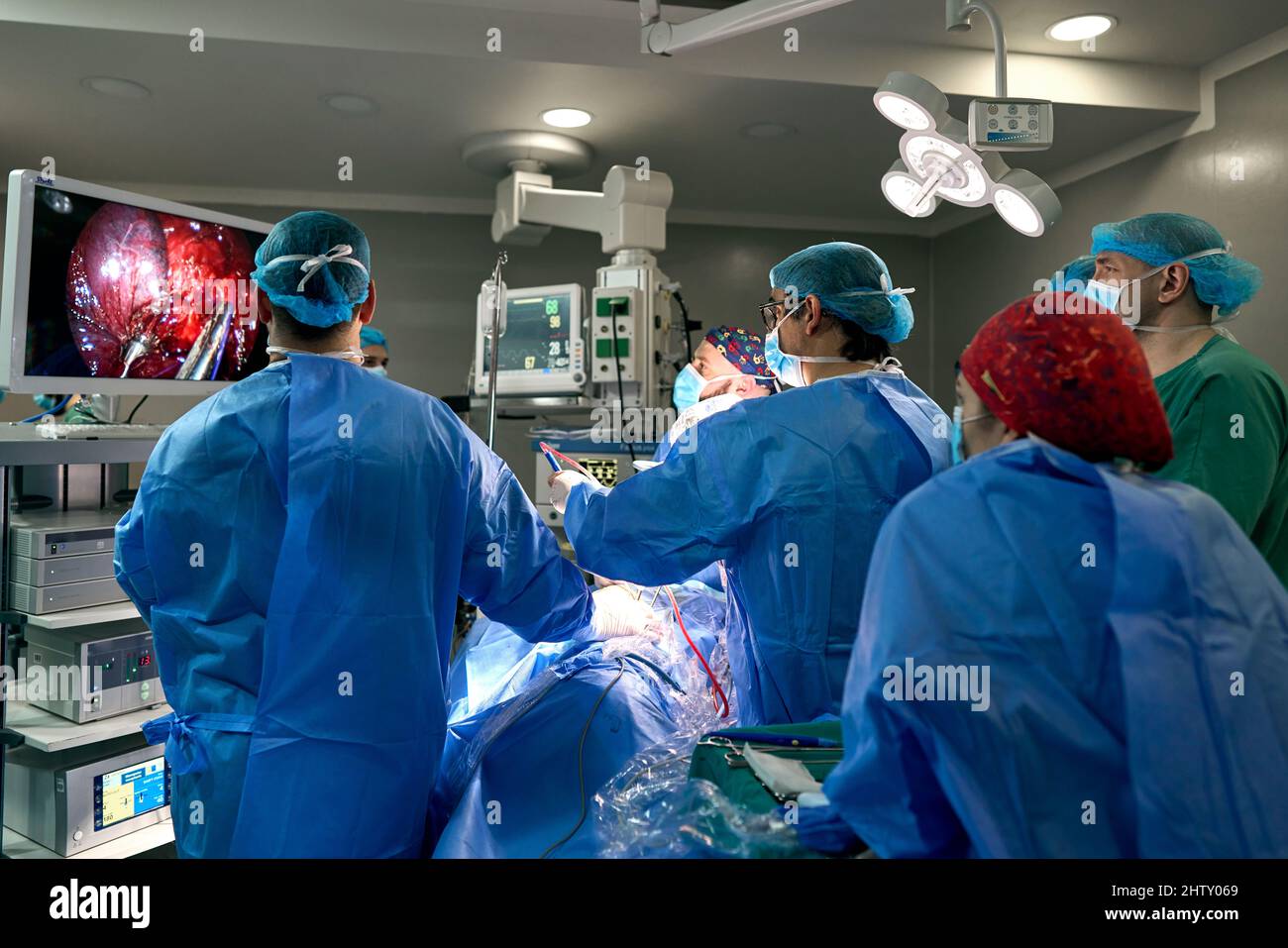 doctors in the operating room perform surgery on a patient Stock Photo ...