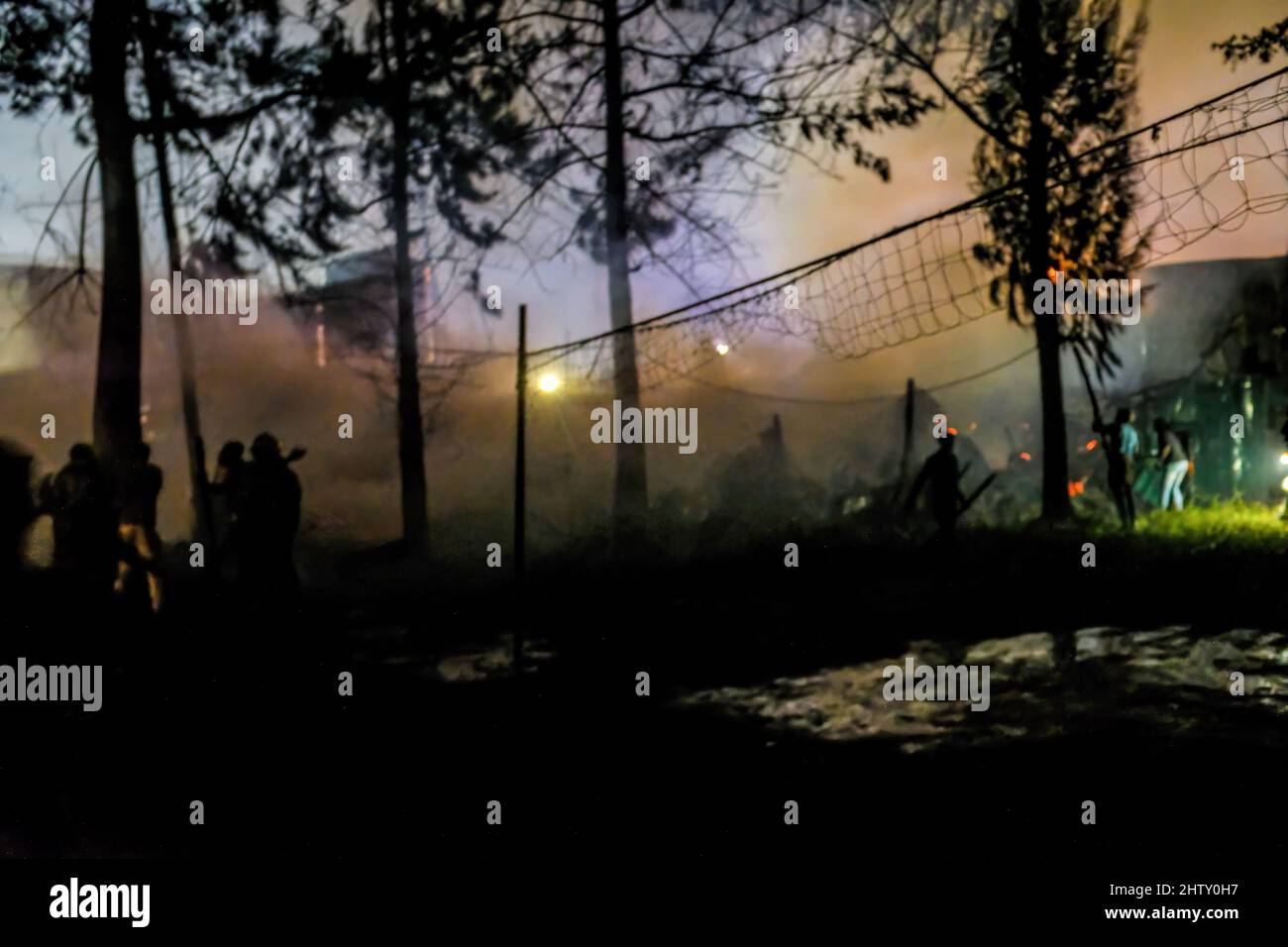 Nairobi, Kenya. 01st Mar, 2022. Residents struggle to put out a night ...