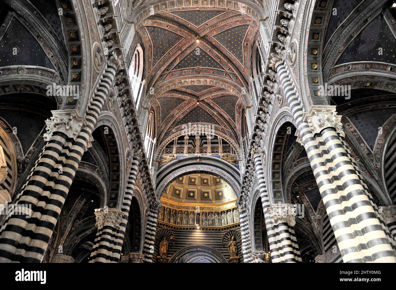 Interior with striped columns and decorated ceiling, Siena Cathedral or ...