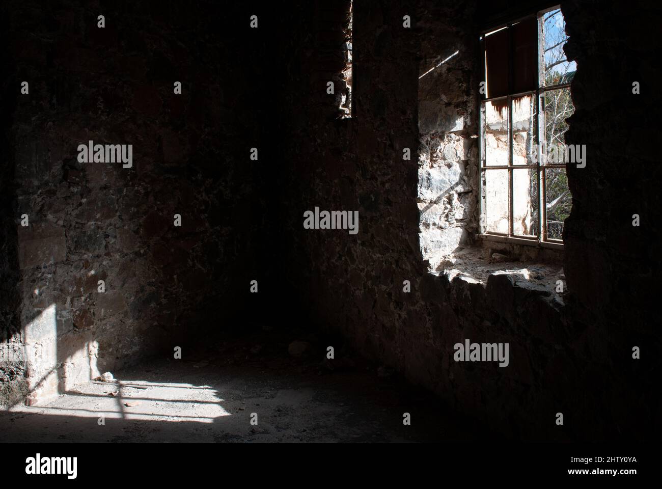 Interior of old abandoned empty room. Broken windows bright sunlight ...
