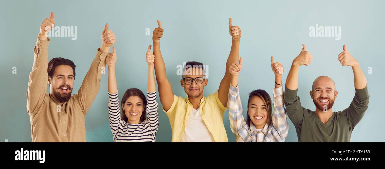 People with approving expression looking at camera showing success and ...