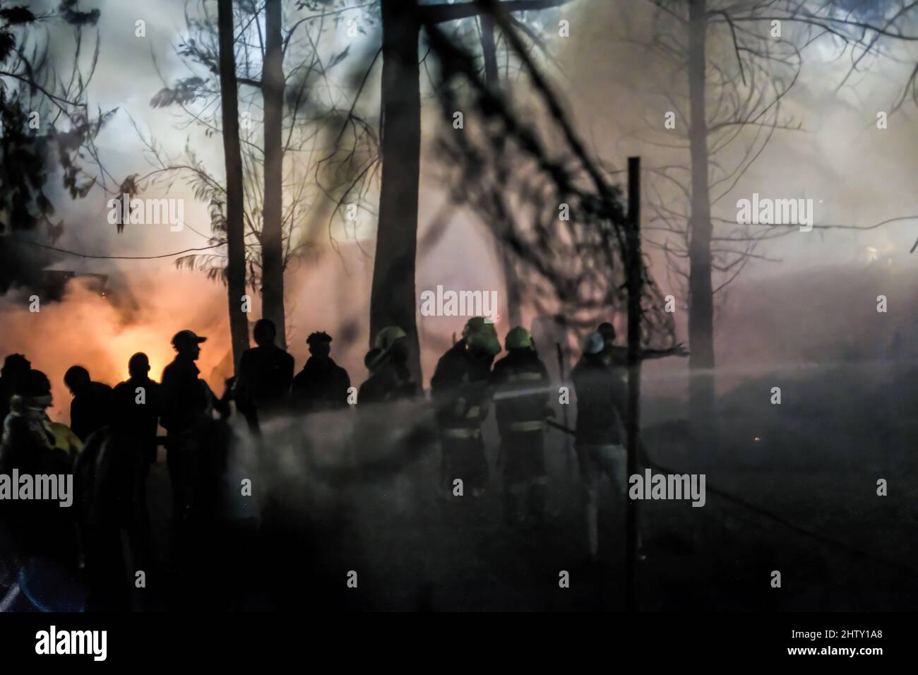Residents and a team from Nairobi City County Fire Fighters struggle to ...