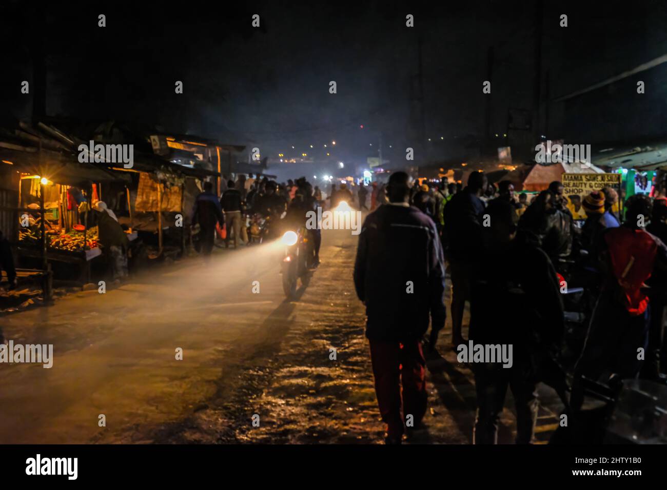 Residents head back to their homes moments after a fire outbreak that ...