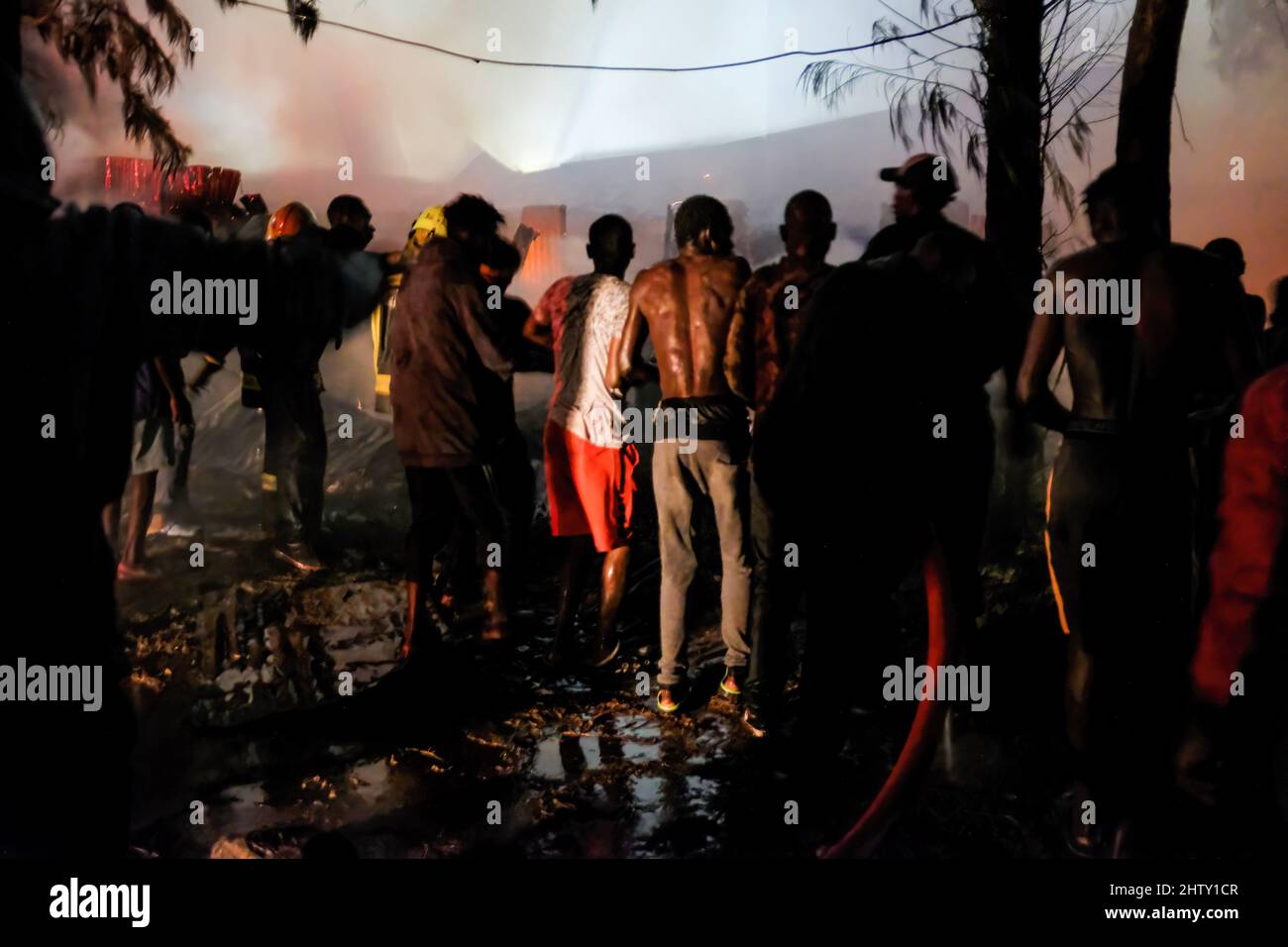 Nairobi, Kenya. 01st Mar, 2022. Residents struggle to put out a night ...