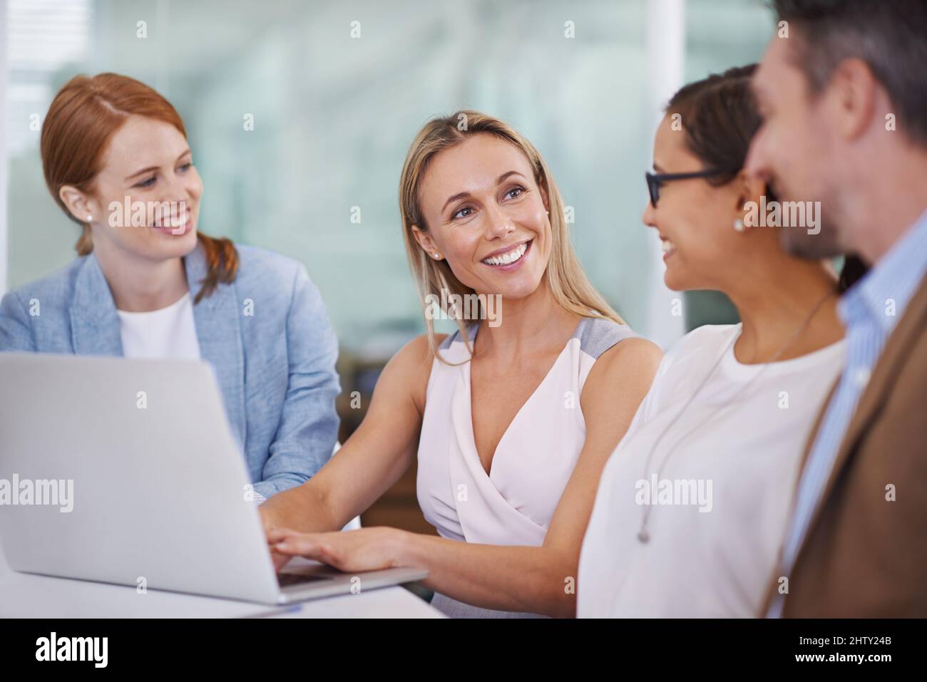 Getting the work done together. A diverse group of businesspeople using ...