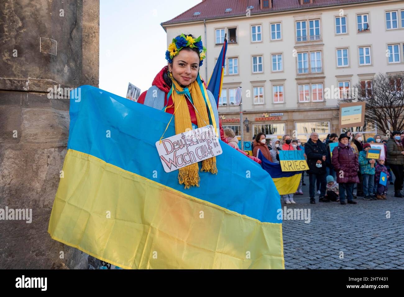 Young woman with Ukrainian flag, protest rally against war in Ukraine ...