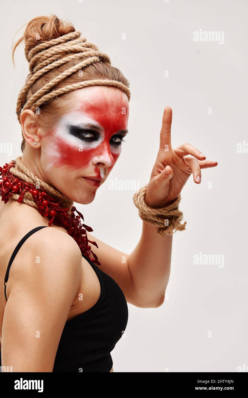 close up portrait of young beautiful girl with colorful face painting ...