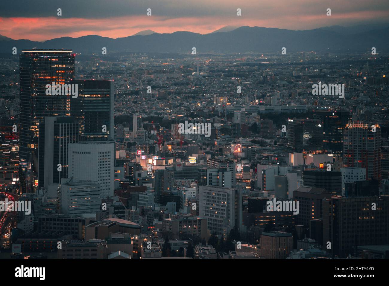 Cityscape of Tokyo with illuminated high-rise modern buildings in the ...