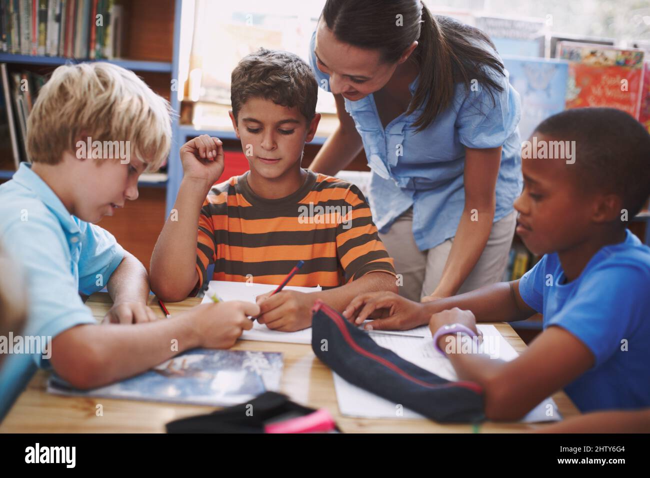 Children helping each other classroom hi-res stock photography and ...