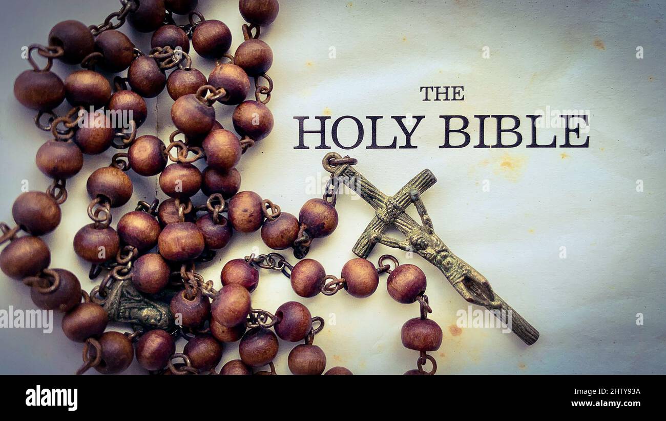 Top view of Holy Bible text with Rosary on old Bible Stock Photo - Alamy
