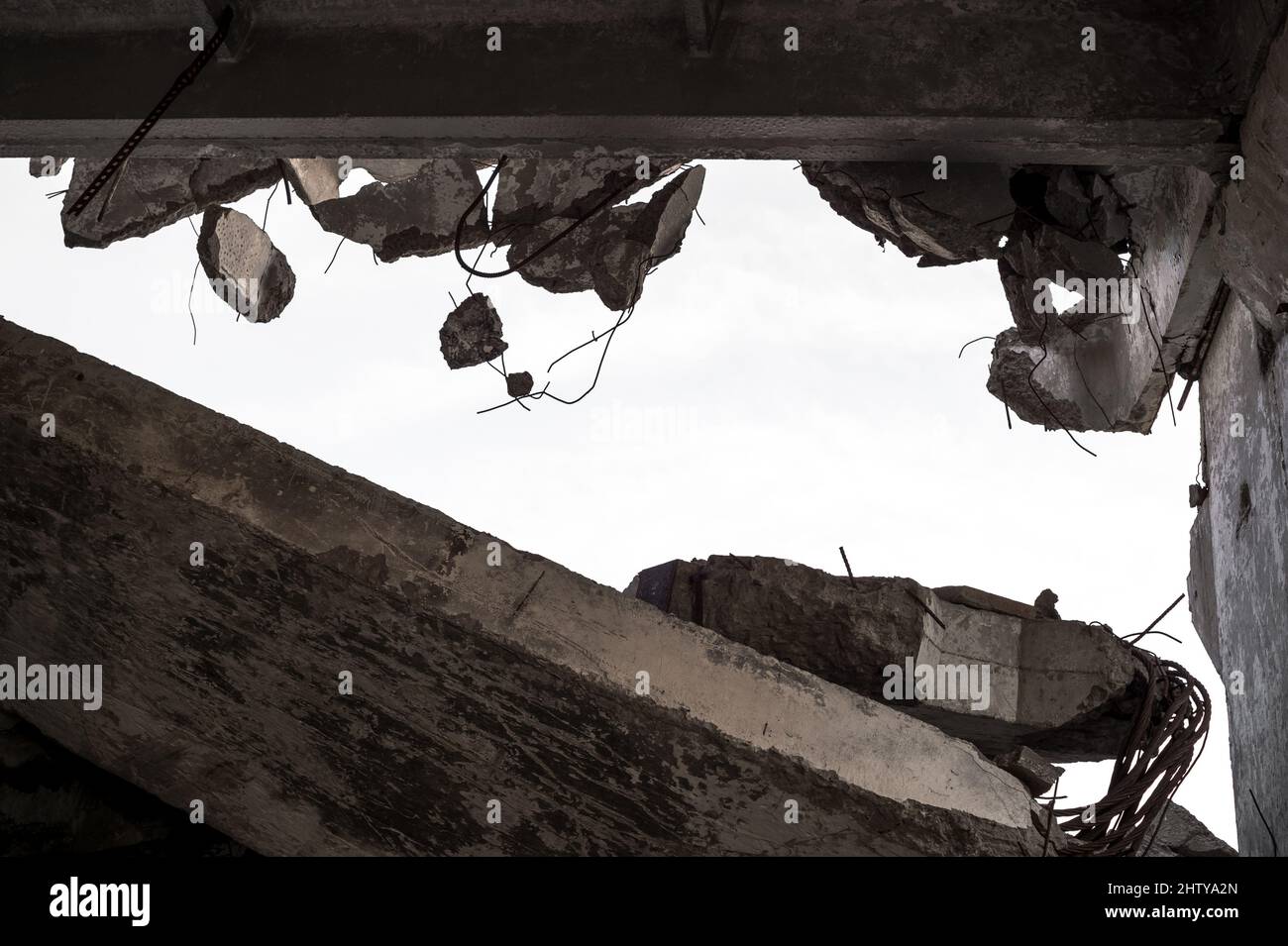 The destroyed wall is a close-up with a bunch of debris against the ...