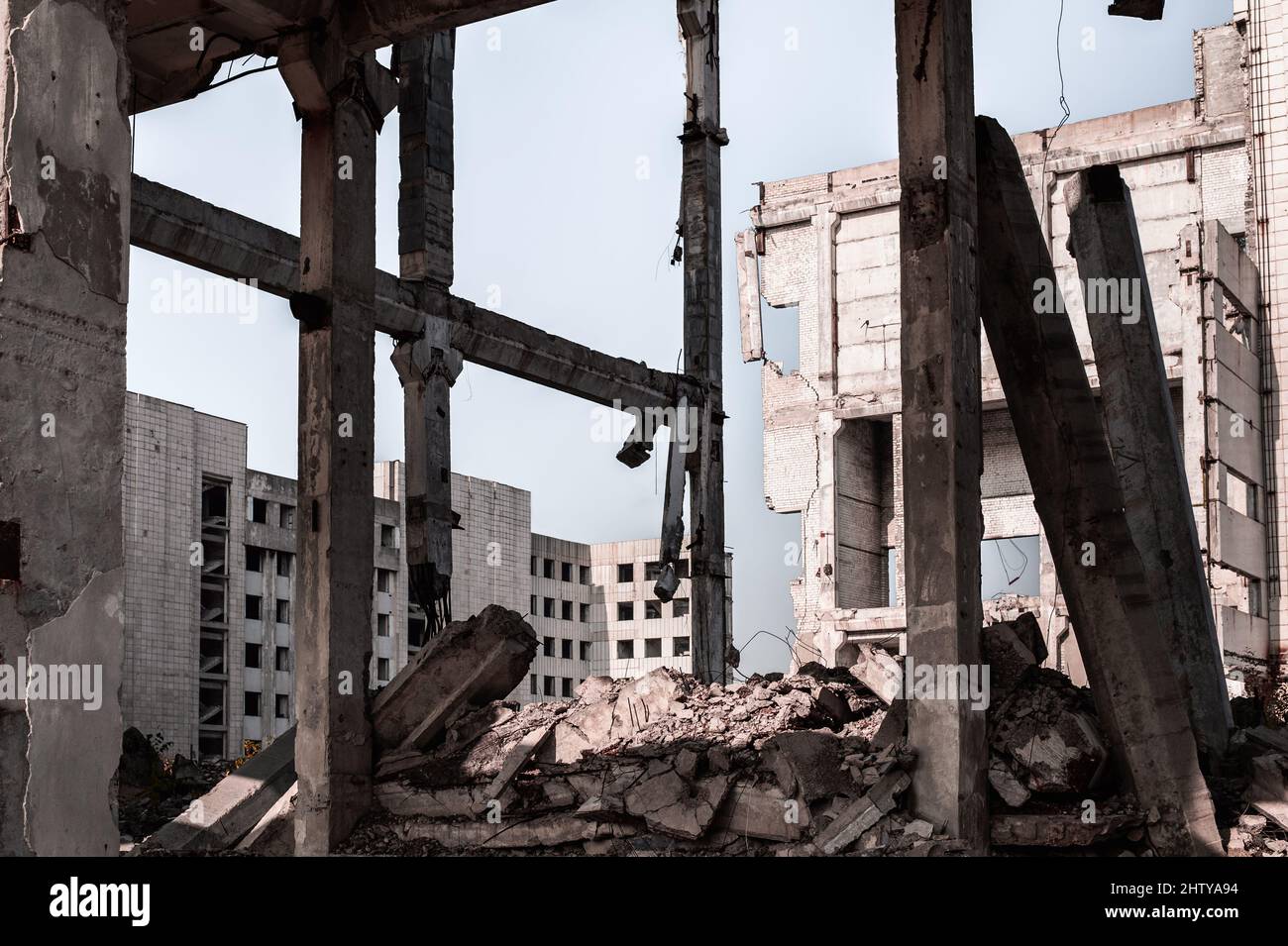 The remains of the frame of the structure with a pile of concrete ...